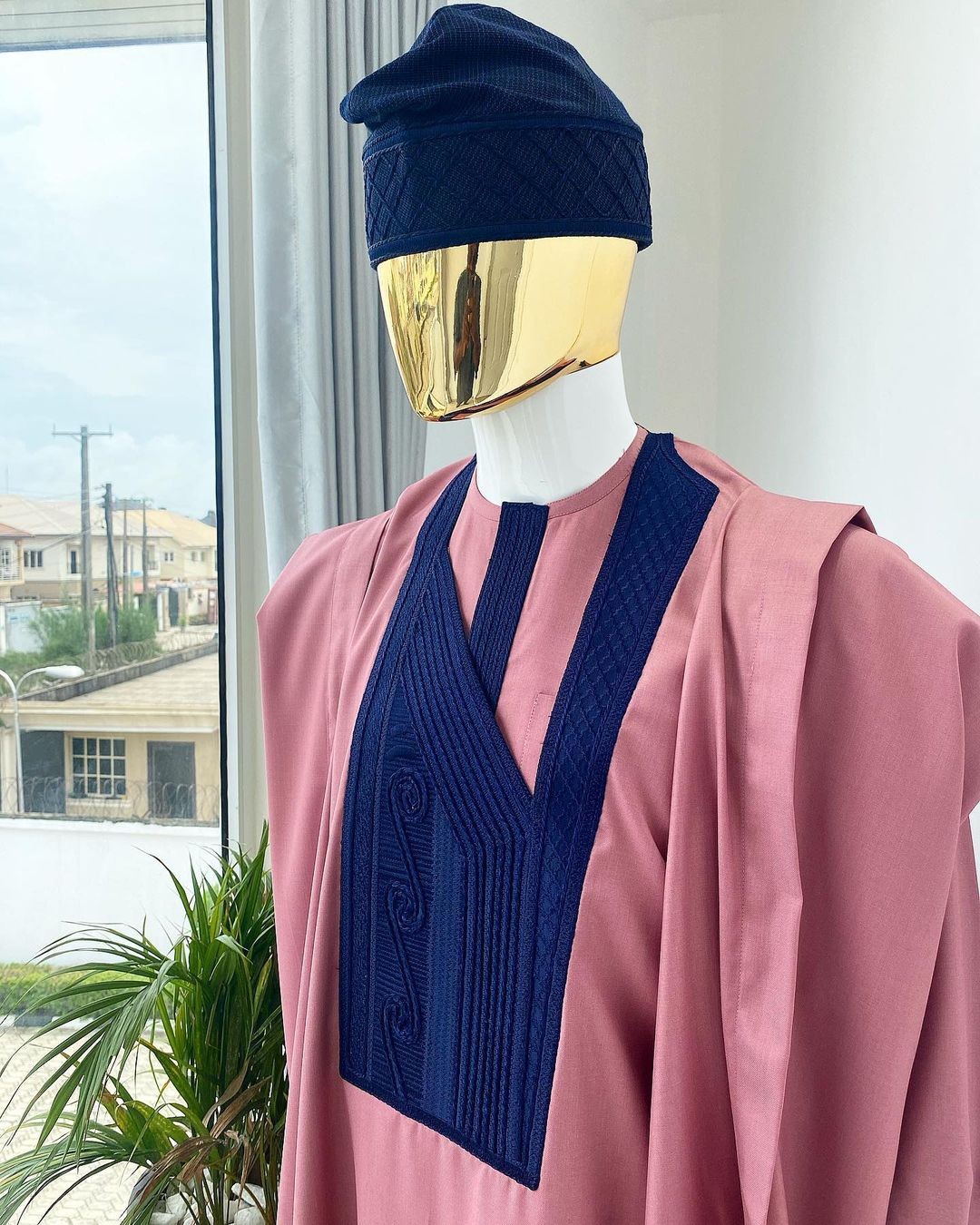 A light beige agbada with a navy blue embroidery design by dejiandkola ...