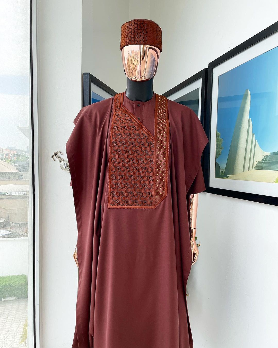 A cinnamon brown agbada, spiral bonding embroidery detailing with black ...