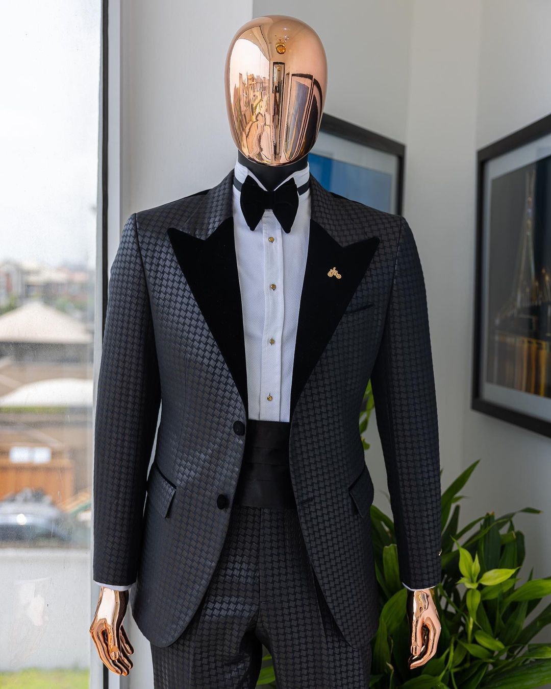 A black inverted square patterned metallic jacquard tuxedo suit by deji ...