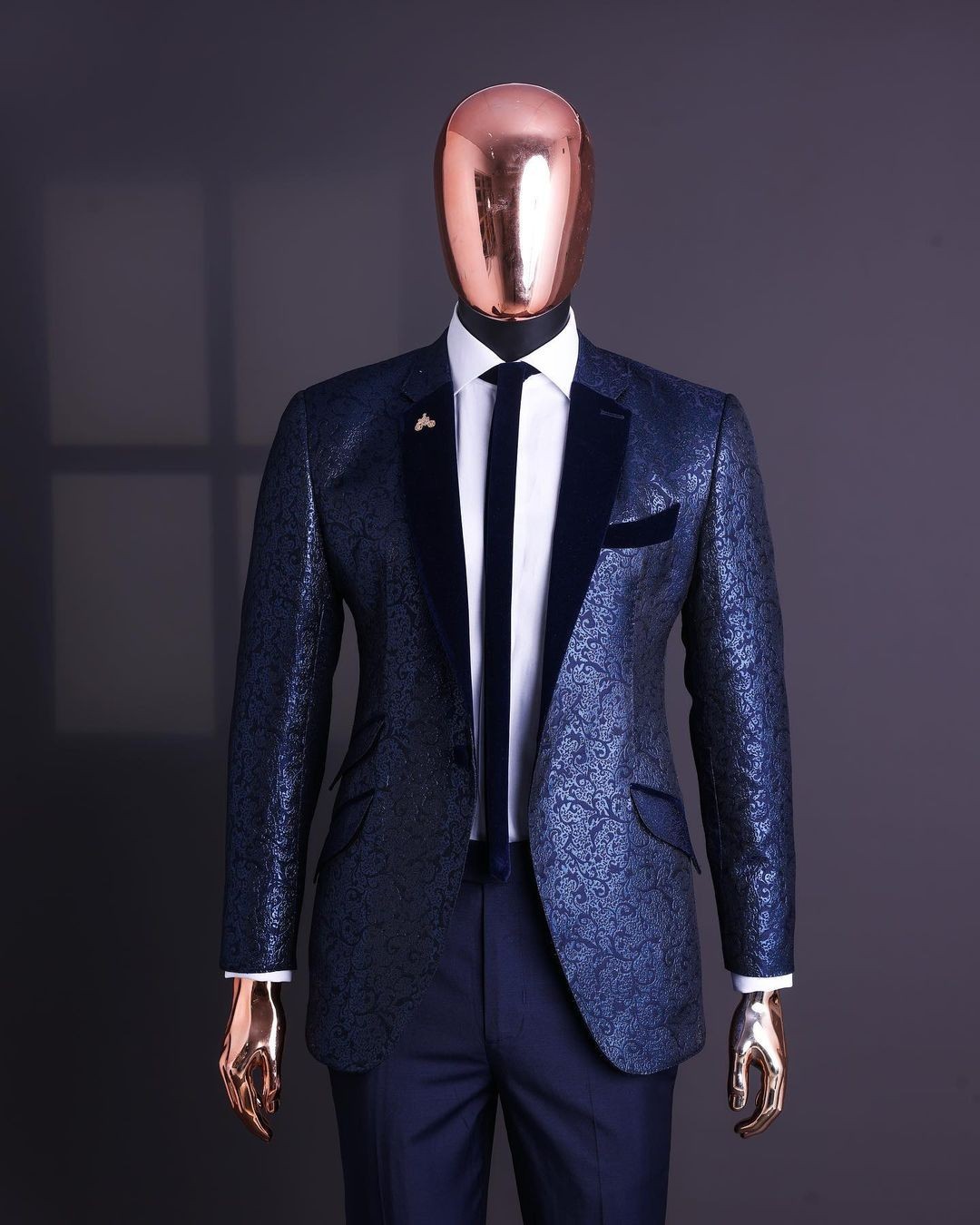 A Navy blue, floral pattern jacquard, slim notch lapel tuxedo suit by d ...