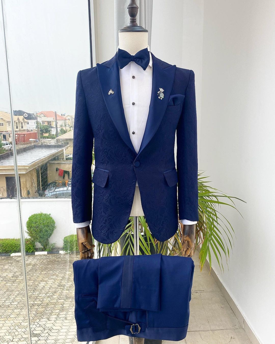 A midnight blue peak lapel floral jacquard tuxedo suit. by dejiandkola ...